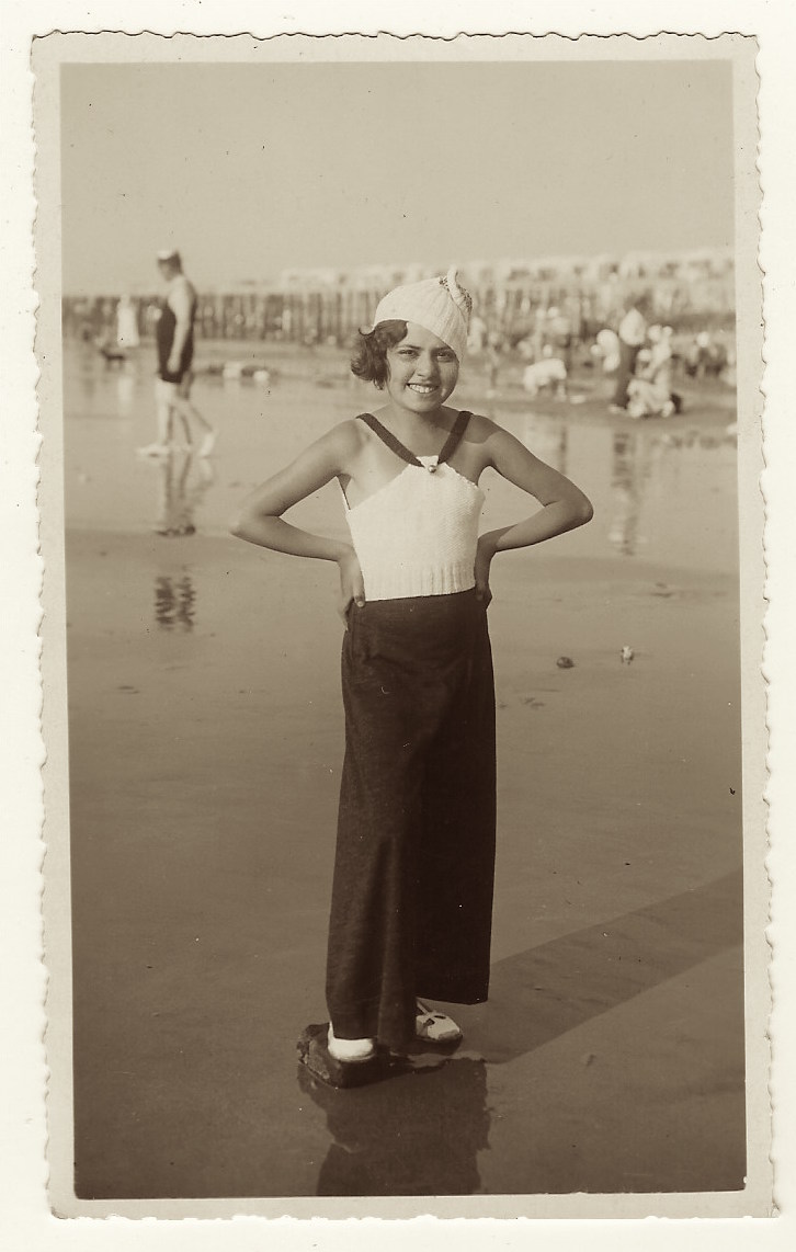 A PRETTY WOMAN WEARING A BATHING SUIT AT THE BEACH IN ORIVAL, FRANCE ...